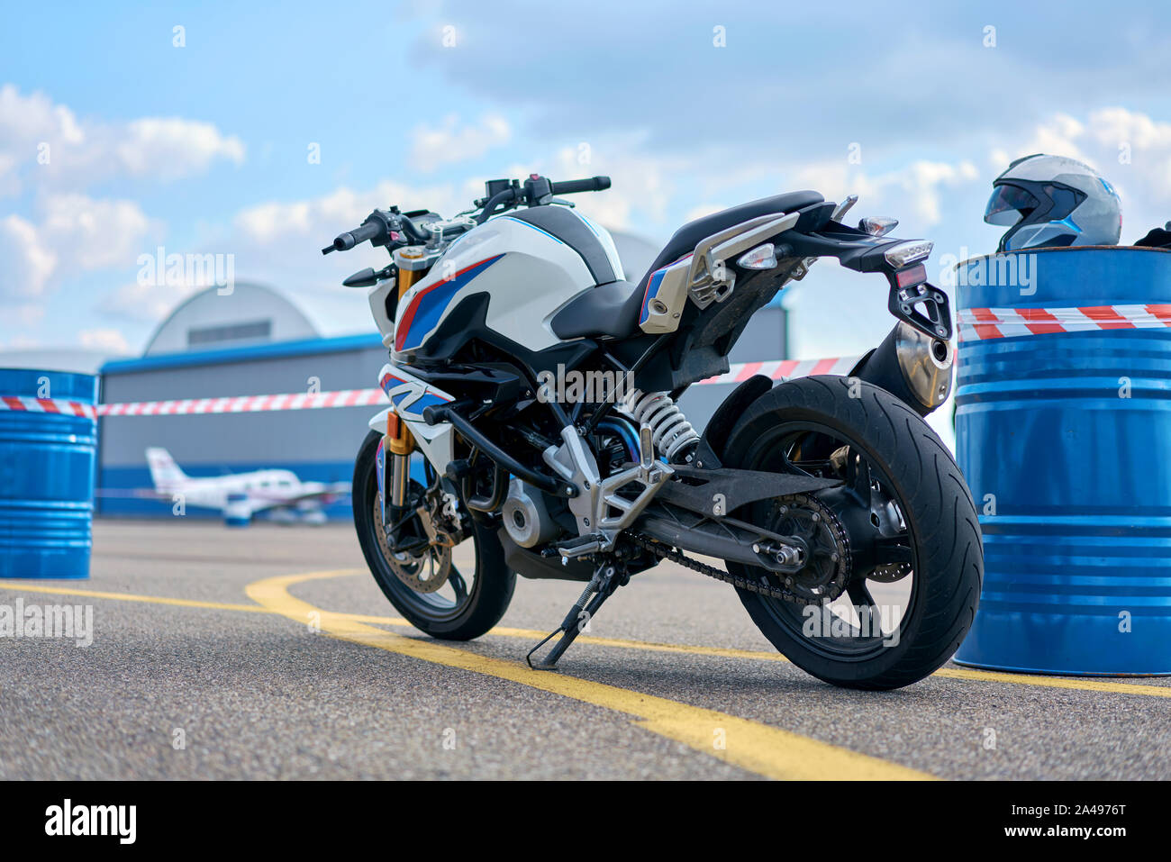 sports motorcycle next to the background of the plane Stock Photo - Alamy