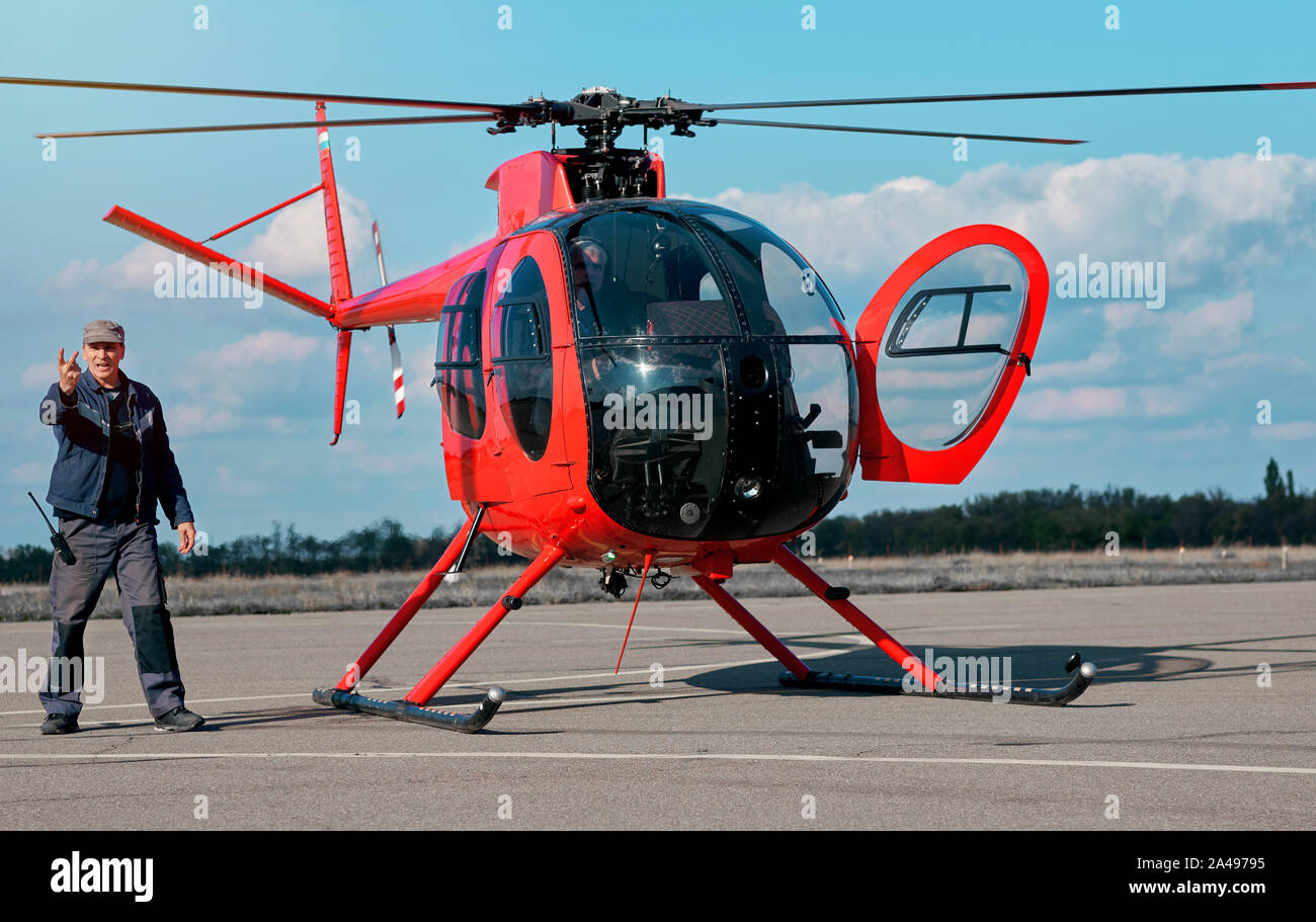red helicopter on the runway Stock Photo - Alamy