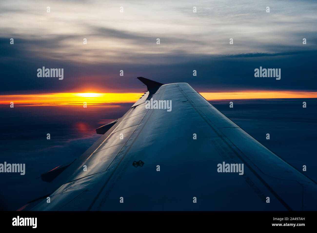 The colorful sunset from an airplane view Stock Photo - Alamy