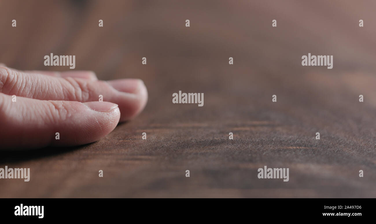 man hand touch oil finished black walnut wood surface, wide photo Stock ...