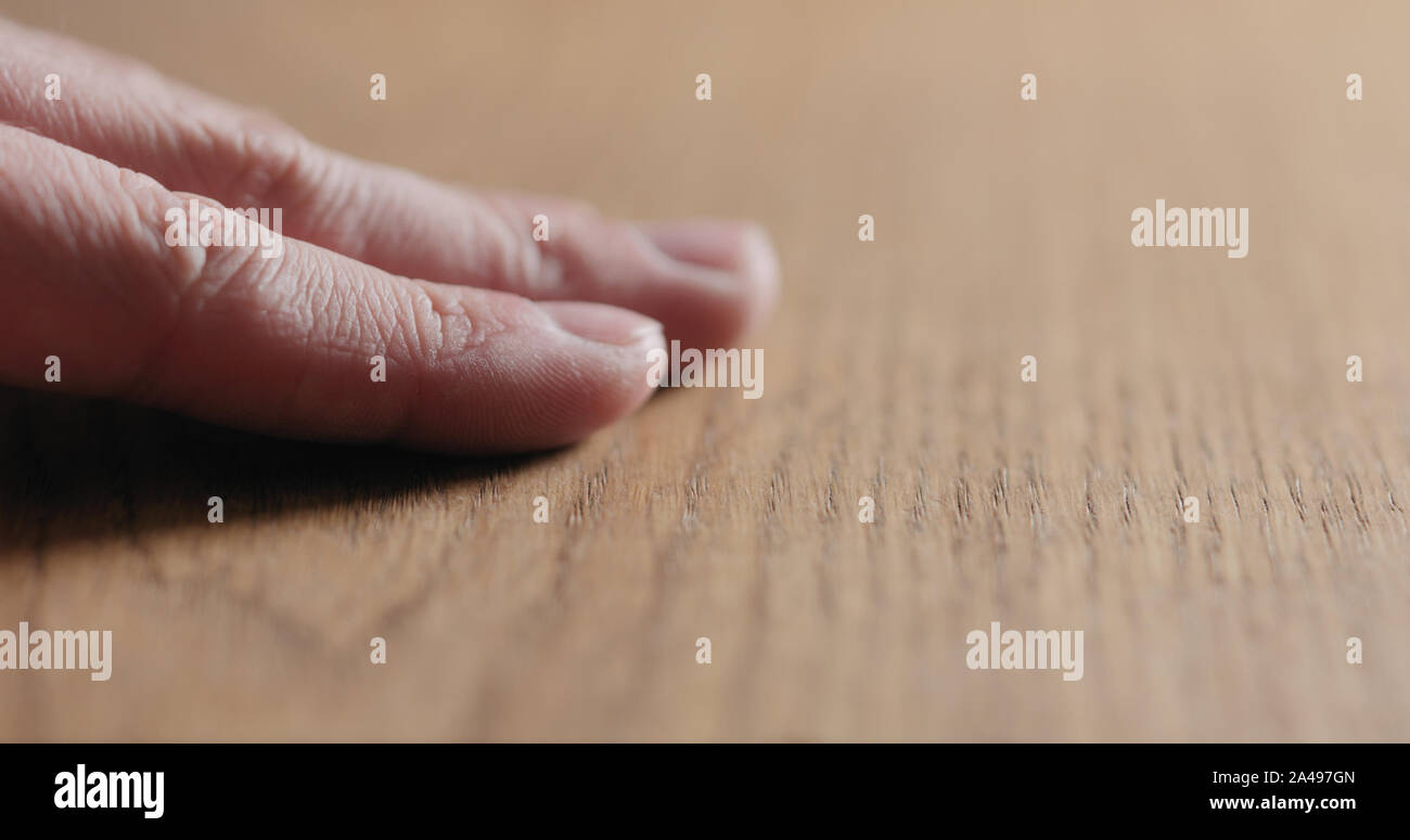 man hand touch oil finished oak wood surface, wide photo Stock Photo ...