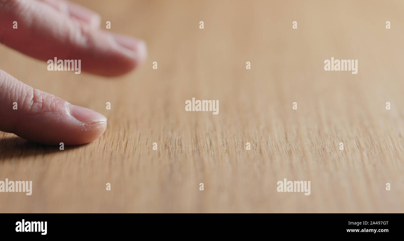 man hand touch oil finished oak wood surface, wide photo Stock Photo ...