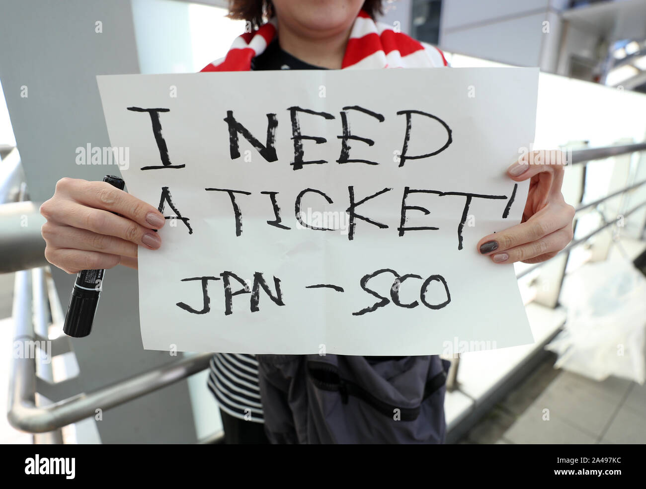 A fan with a sign asking for tickets before the 2019 Rugby World Cup ...
