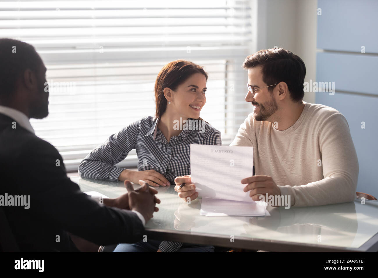 Happy family couple clients meeting african american financial ...