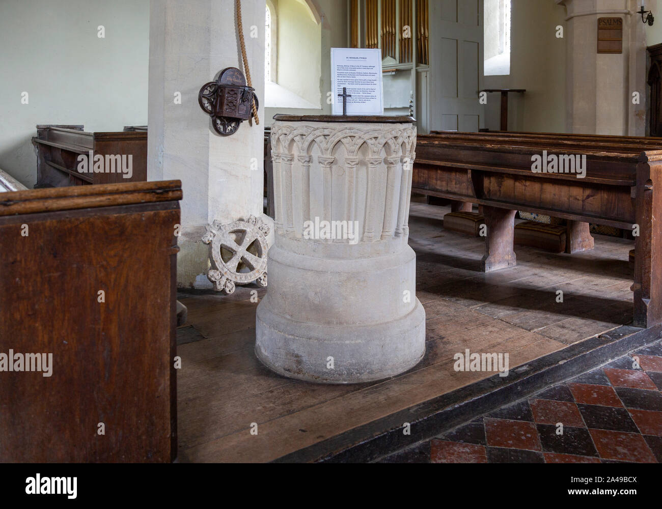 Historic stone baptismal font village parish church of Saint Nicholas ...