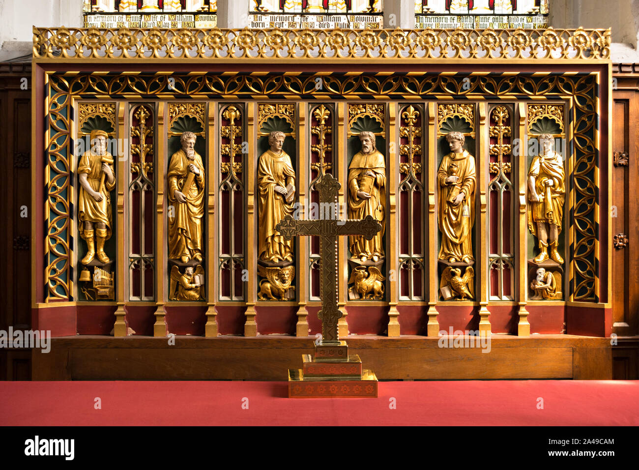 Crucifix and ornate carved wooden Reredos panel depicting six Christian ...