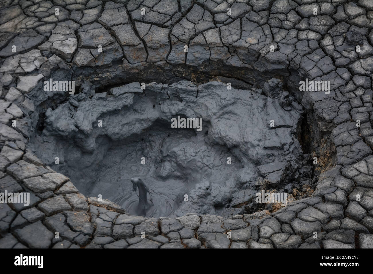 Sculptures of boiling grey mud in Hverir, Krafla geothermal area ...