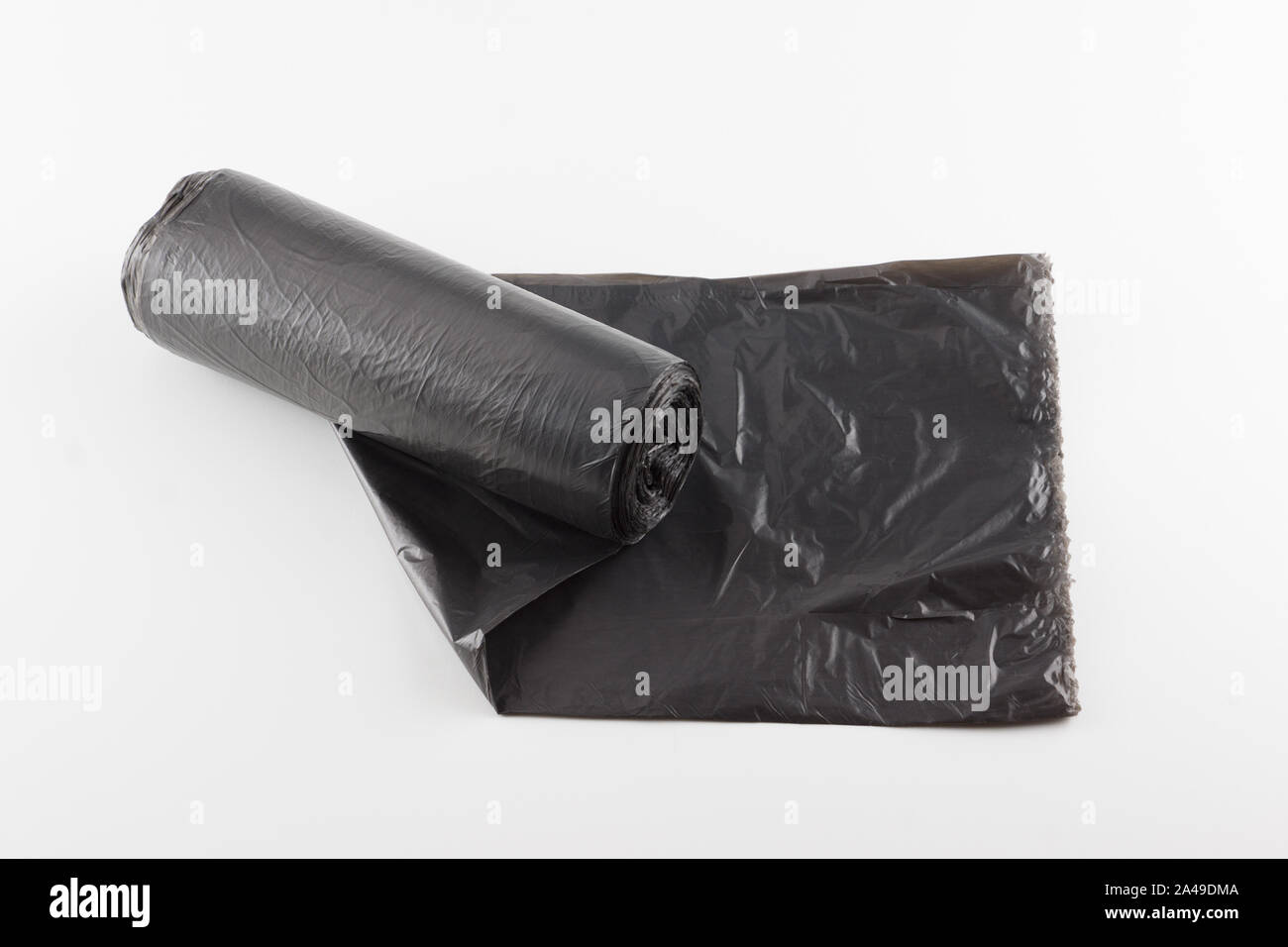 big roll of trash bags isolated on white background Stock Photo - Alamy