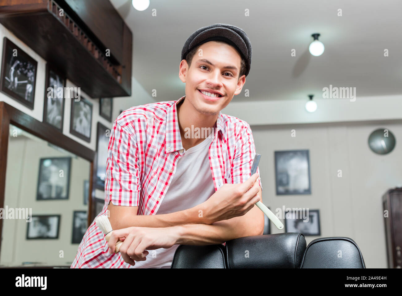Smiling professional hairdresser posing in salon Stock Photo - Alamy