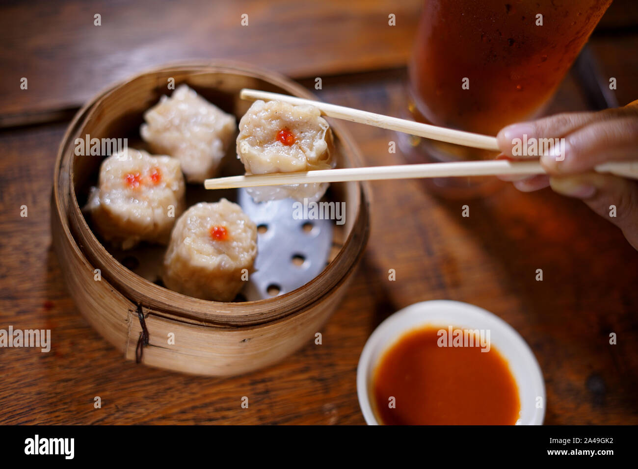 Dim Sum Chinese traditional food on wooden table Stock Photo - Alamy