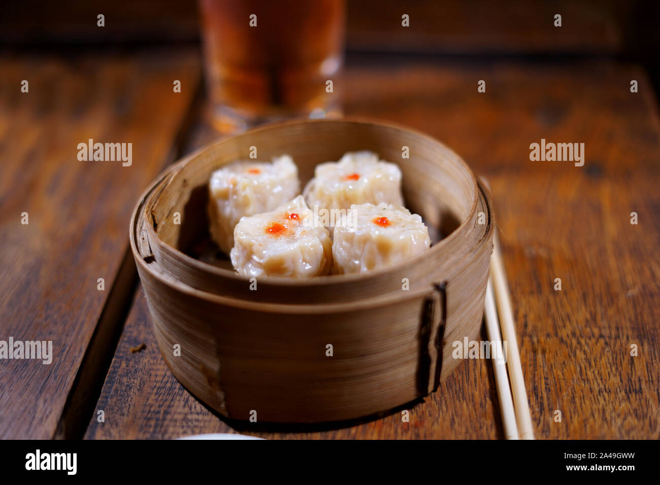 Dim Sum Chinese traditional food on wooden table Stock Photo - Alamy