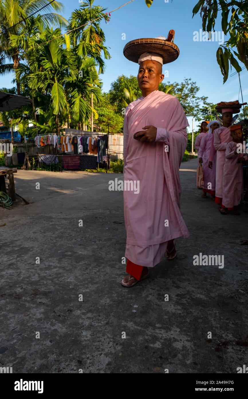 Buddhist nuns in Yangon, Myanmar wearing the traditional pink robes ...