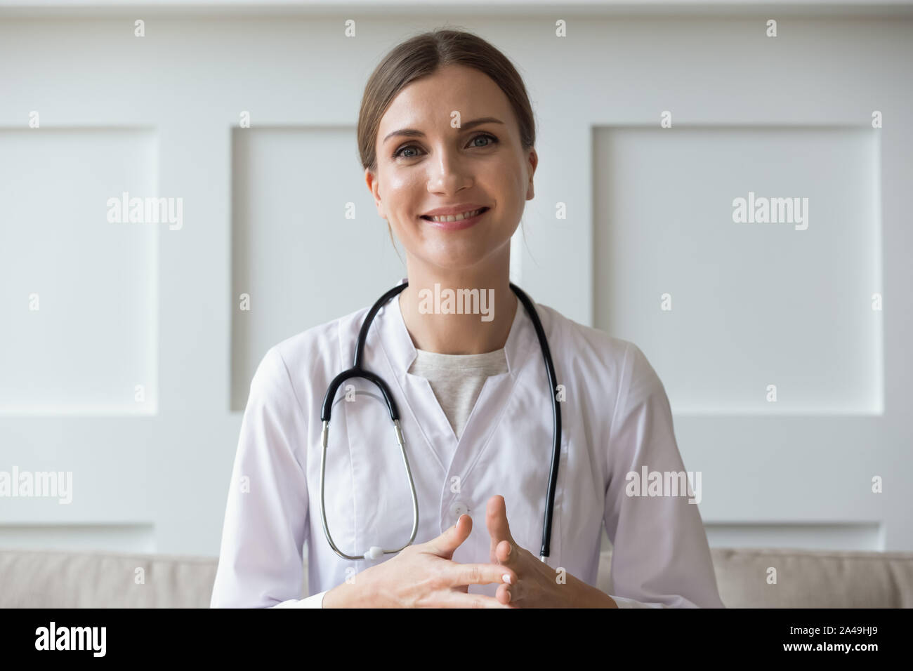 Pretty female doctor talking camera hi-res stock photography and images ...