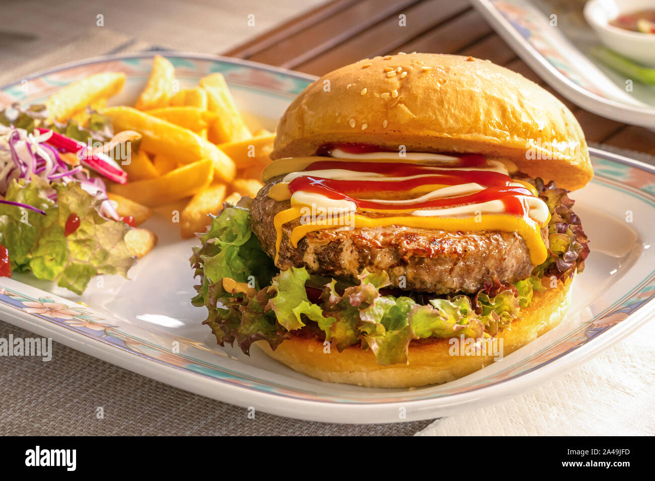 Beef Burger in a Sesame Seed Bun with Fries with a cutlet, beautifully ...