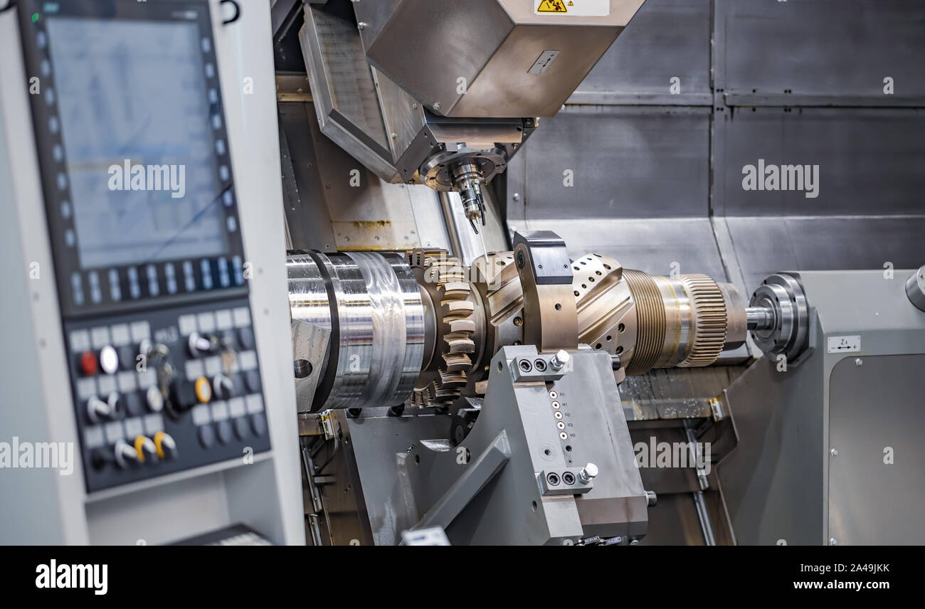 Metalworking CNC lathe milling machine. Cutting metal modern processing technology. Milling is ...