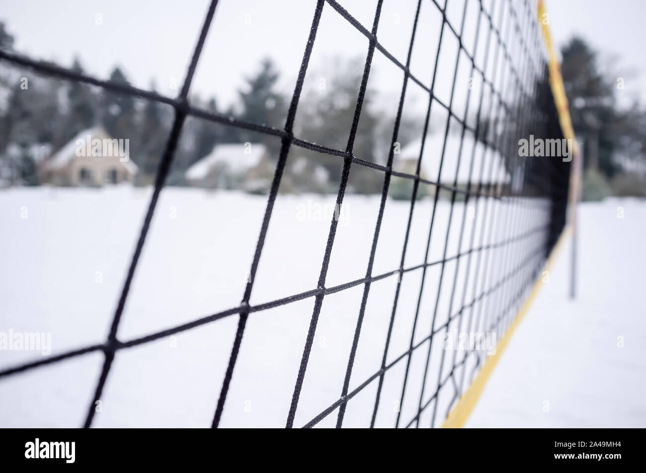 Volleyball net in the winter snowy day, against a blurred background of ...