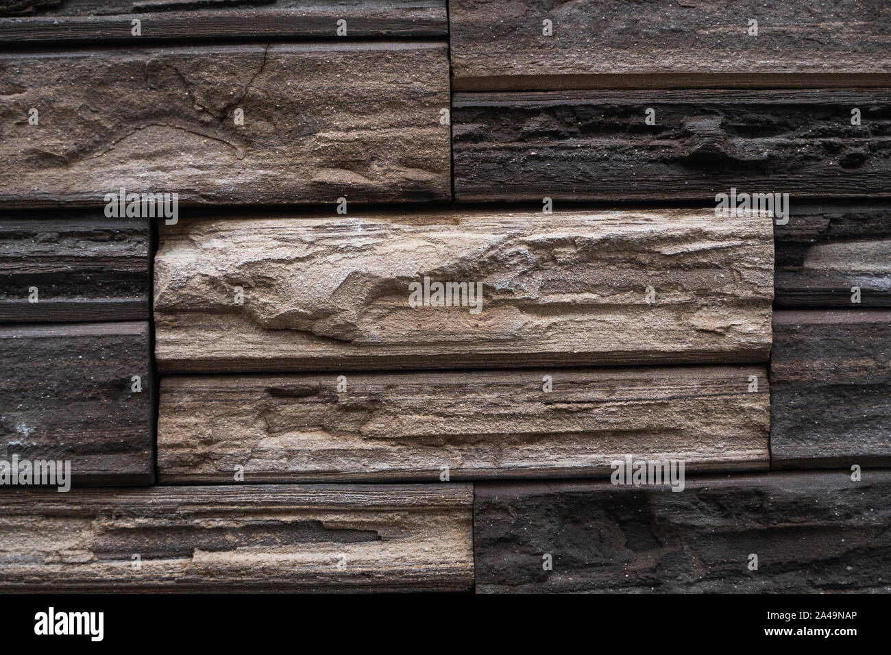 Natural stone bricks as a decoration on a wall. Natural stone wall ...