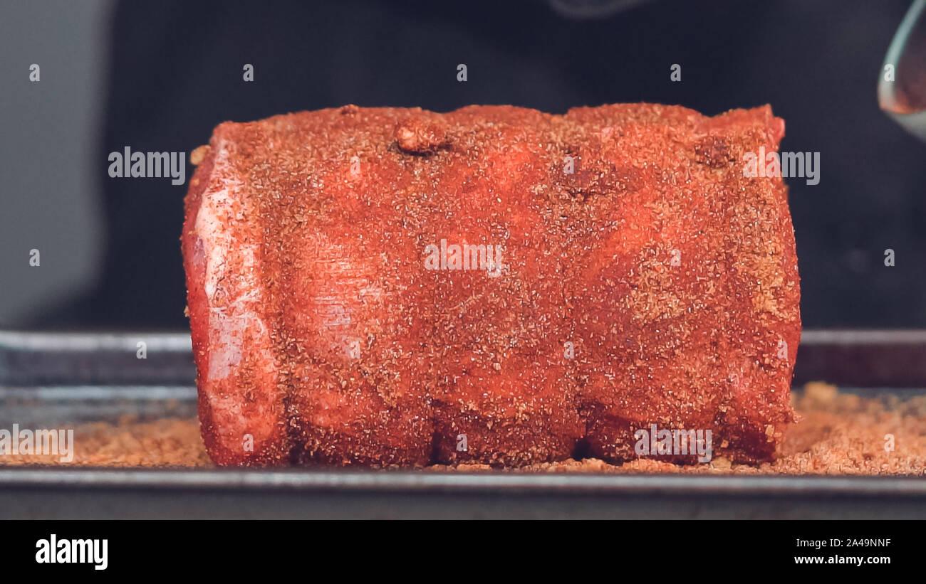 Step by step. Chef rubbing spices rub over boneless pork roast Stock ...