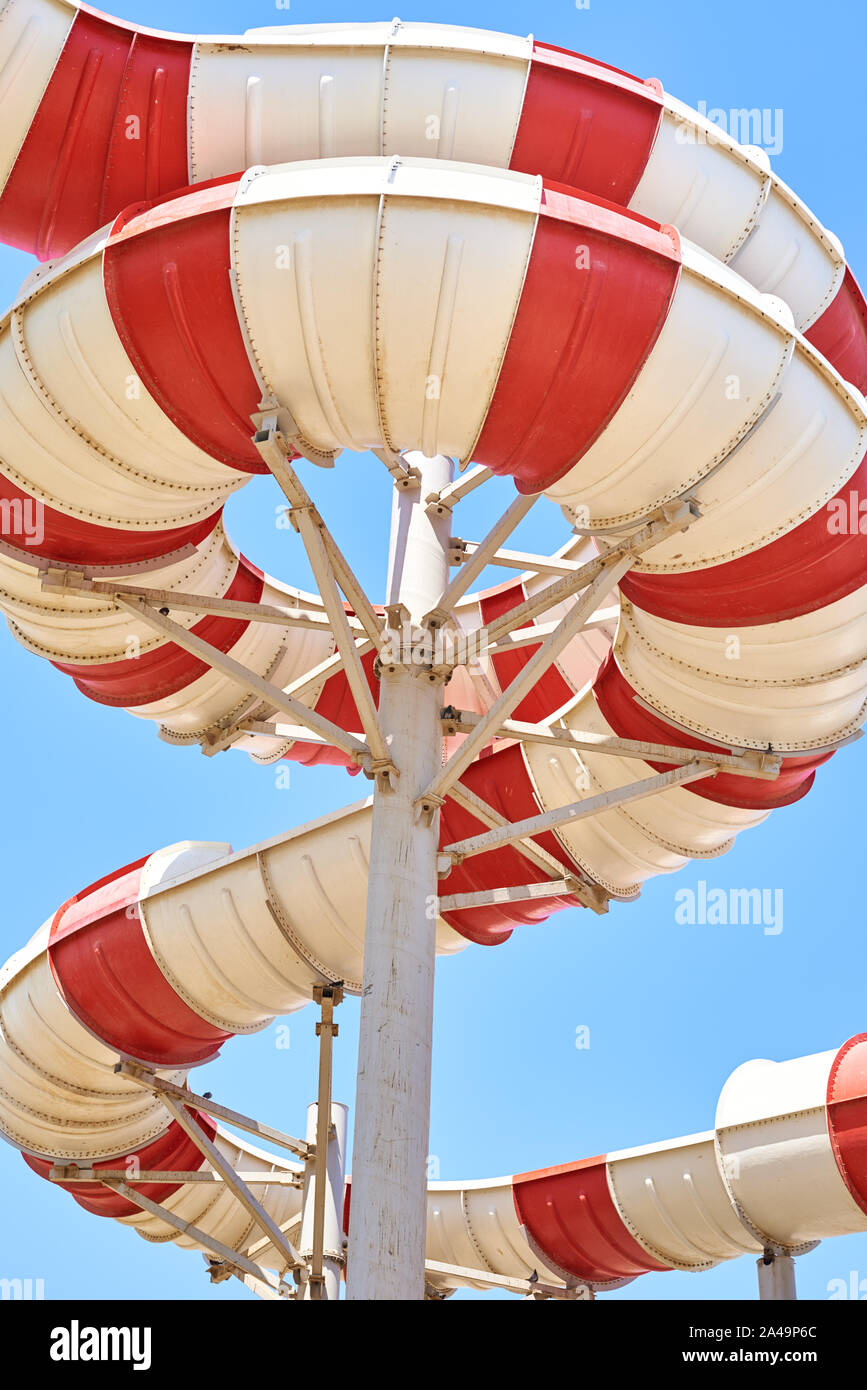 Close up of tube water slide in aqua park against blue sky Stock Photo ...