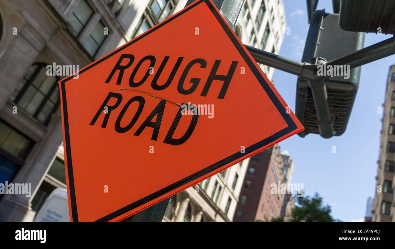 Rough Road sign in Manhattan, slightly tilted Stock Photo - Alamy