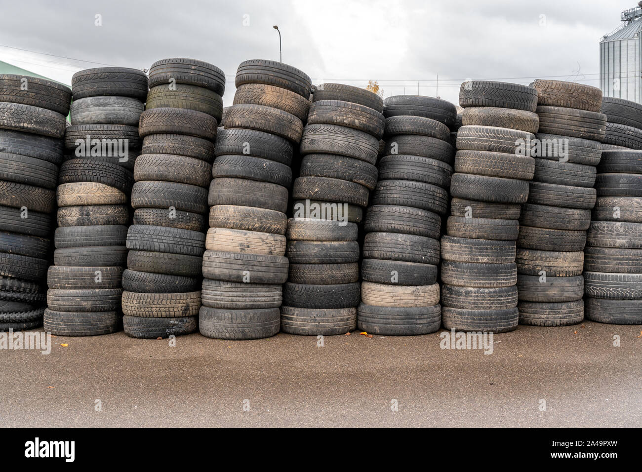 Pile of old car tires on the ground, ready for recycling Stock Photo ...