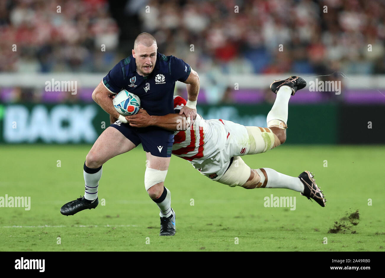 Scotland's Stuart Hogg is tackle by Japan's Michael Leitch during the ...