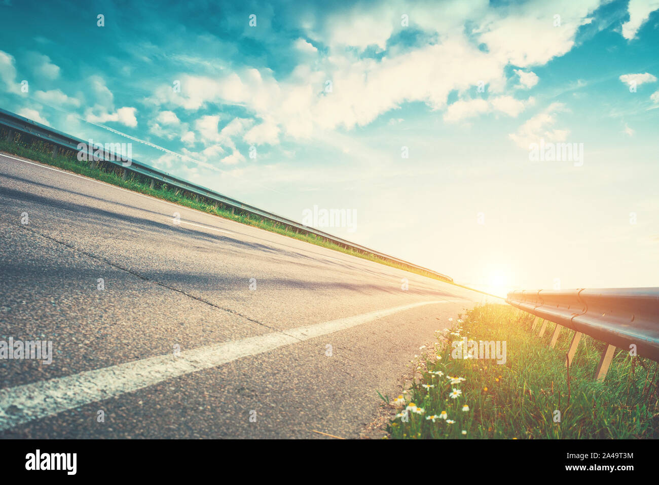 Panoramic road sunrise summer travel background Stock Photo - Alamy