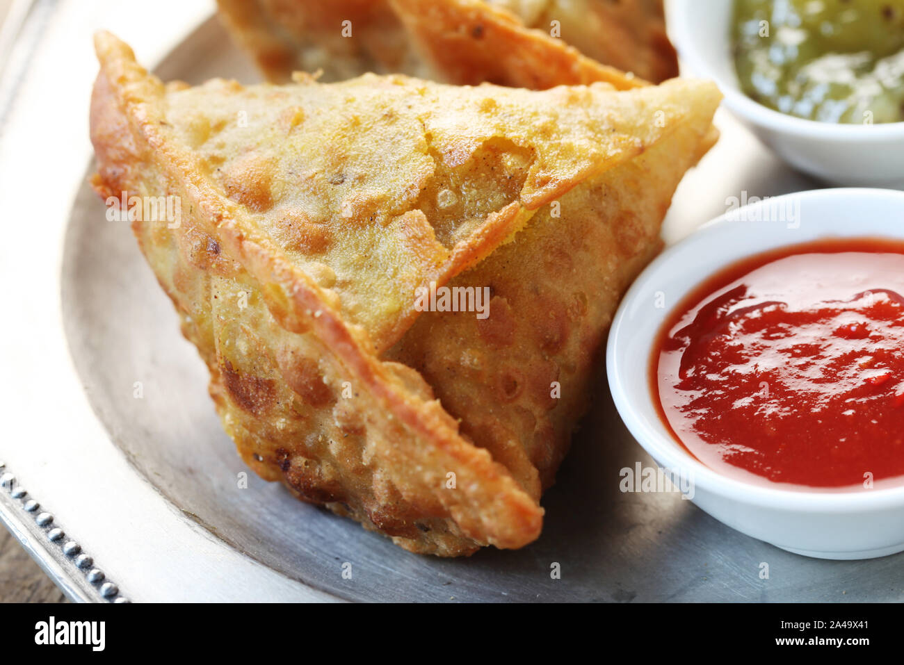 Samosas With Sauces Stock Photo - Alamy