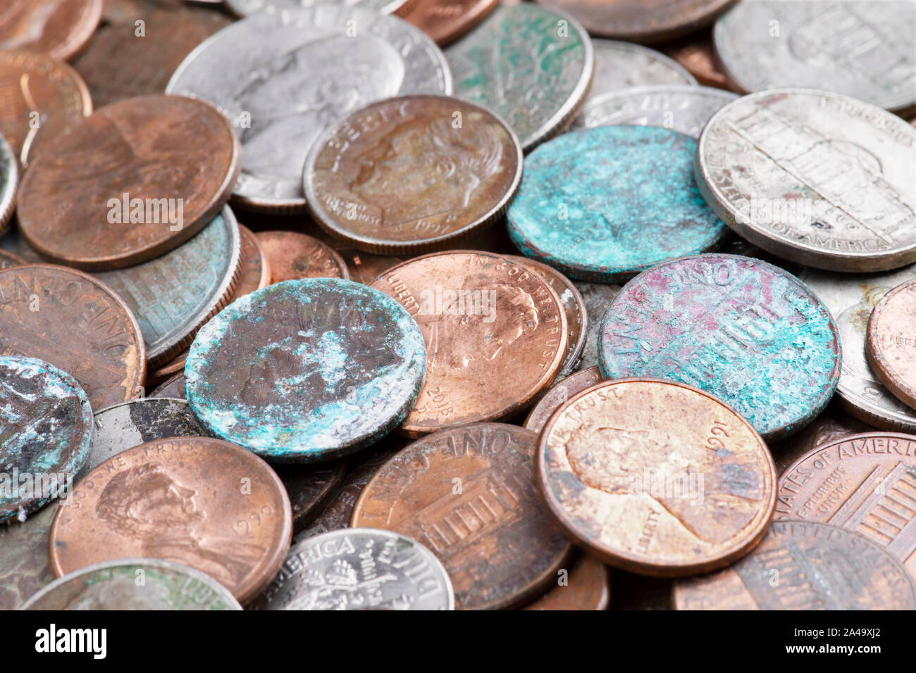 Dirty coins hi-res stock photography and images - Alamy
