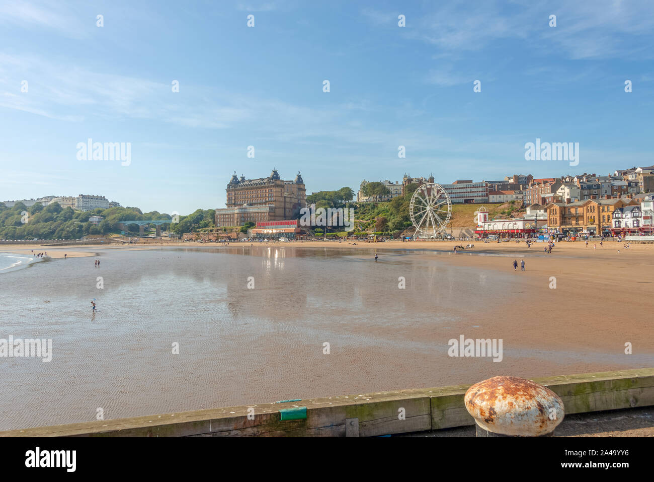 People enjoy the sunshine on the beach at Scarborough in late summer. A ...