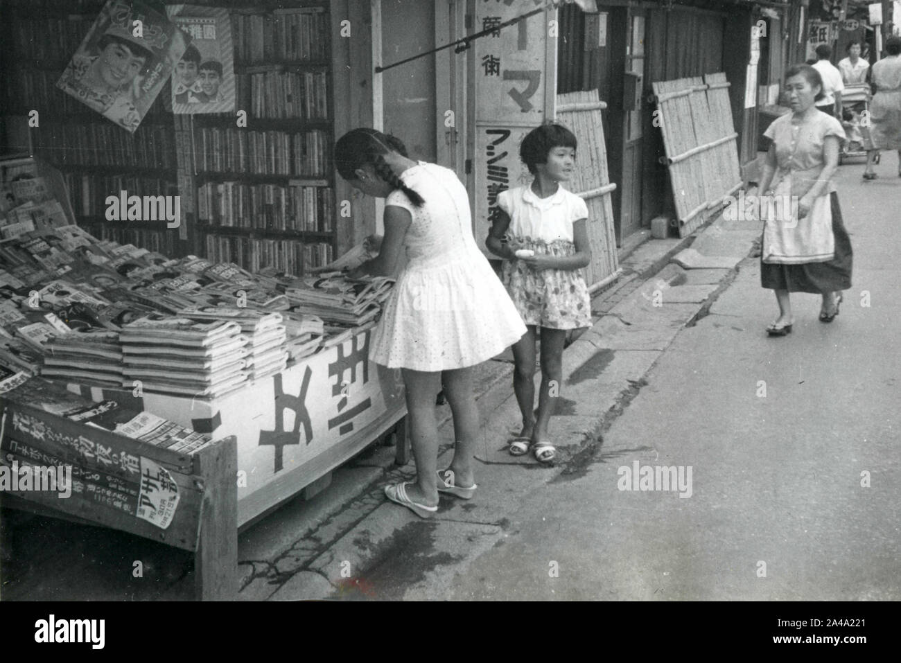 Children at a newspaper and book shop, Japan 1958 Stock Photo - Alamy