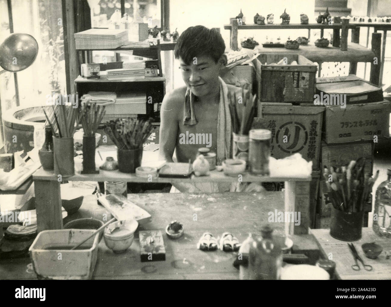 Boy working in an art shop, Japan 1958 Stock Photo - Alamy