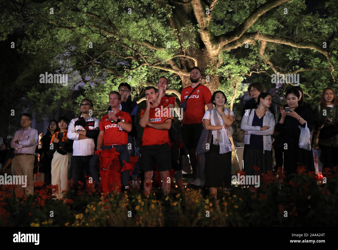 Rugby fans watch the Japan v Scotland match on a big screen in Kumamoto ...