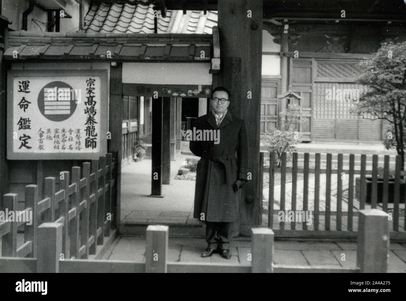 Man posing in a shrine, Japan 1958 Stock Photo - Alamy
