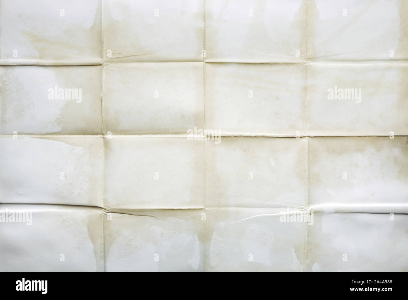 Old paper sheet aged and folded in sixteen, texture background Stock ...