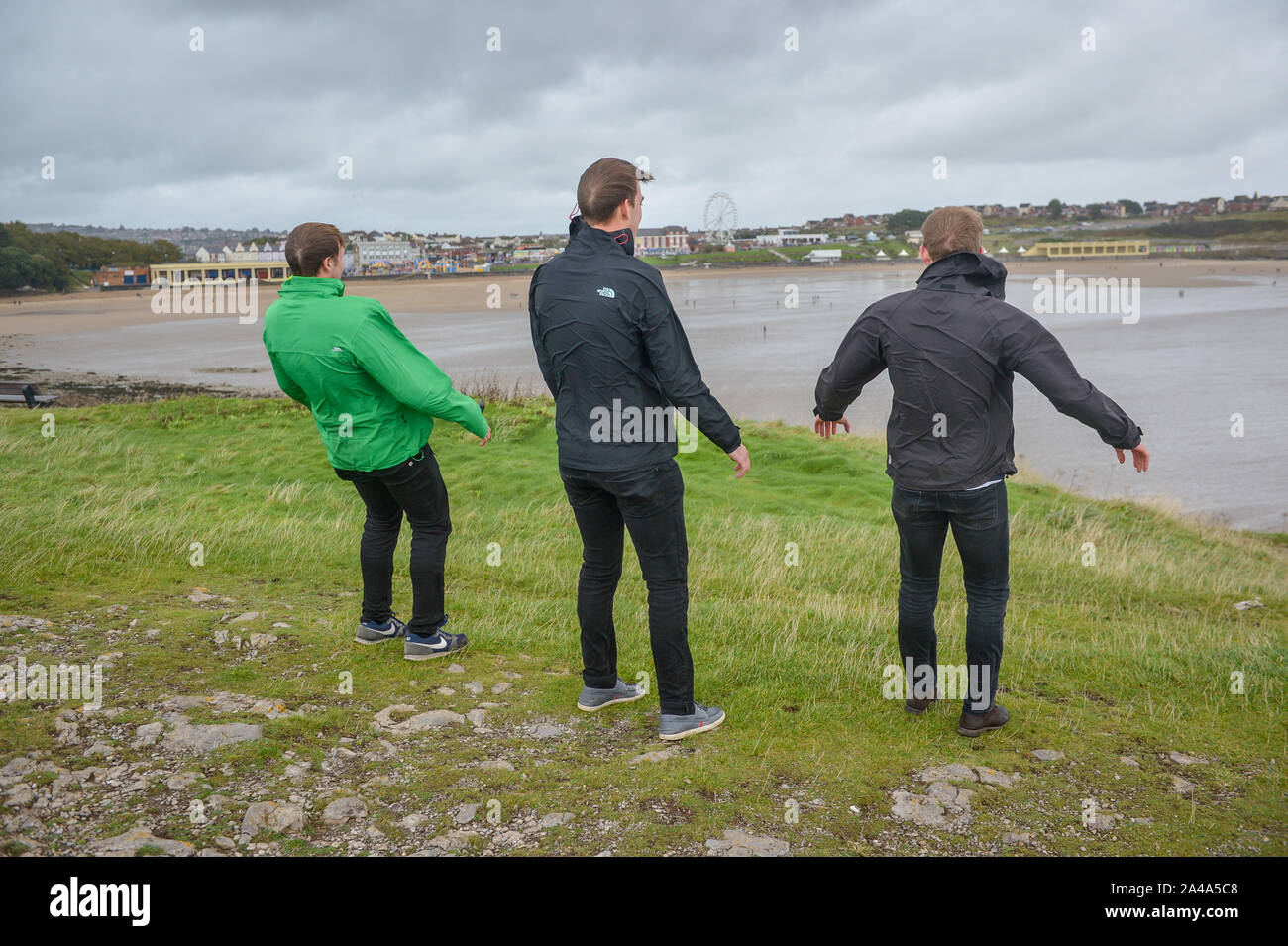 Three men lean hi-res stock photography and images - Alamy