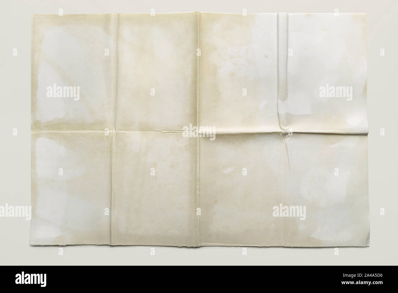 Empty sheet folded in eight, old paper isolated on gray background ...