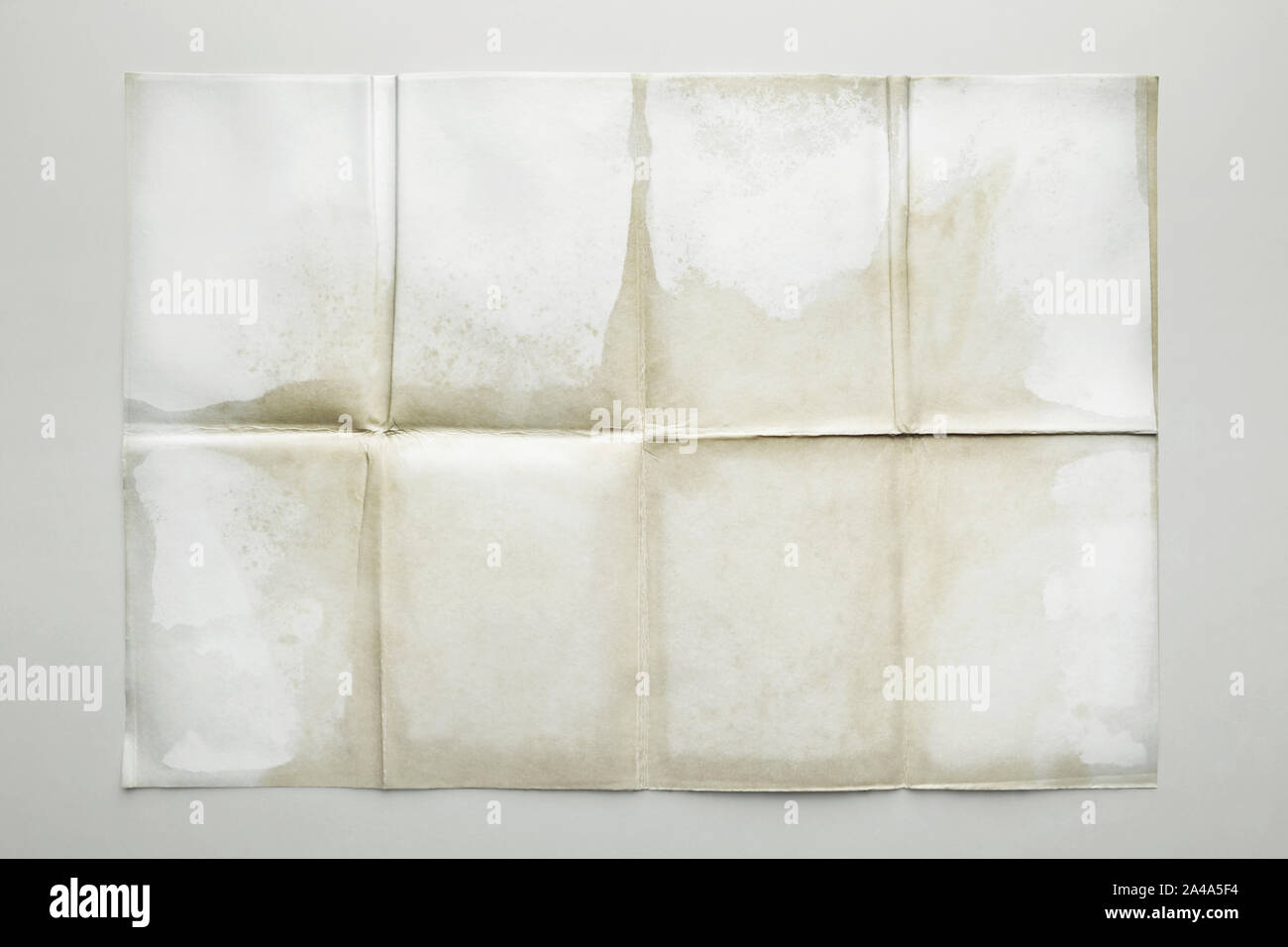 Empty sheet folded in eight, old paper isolated on gray background ...