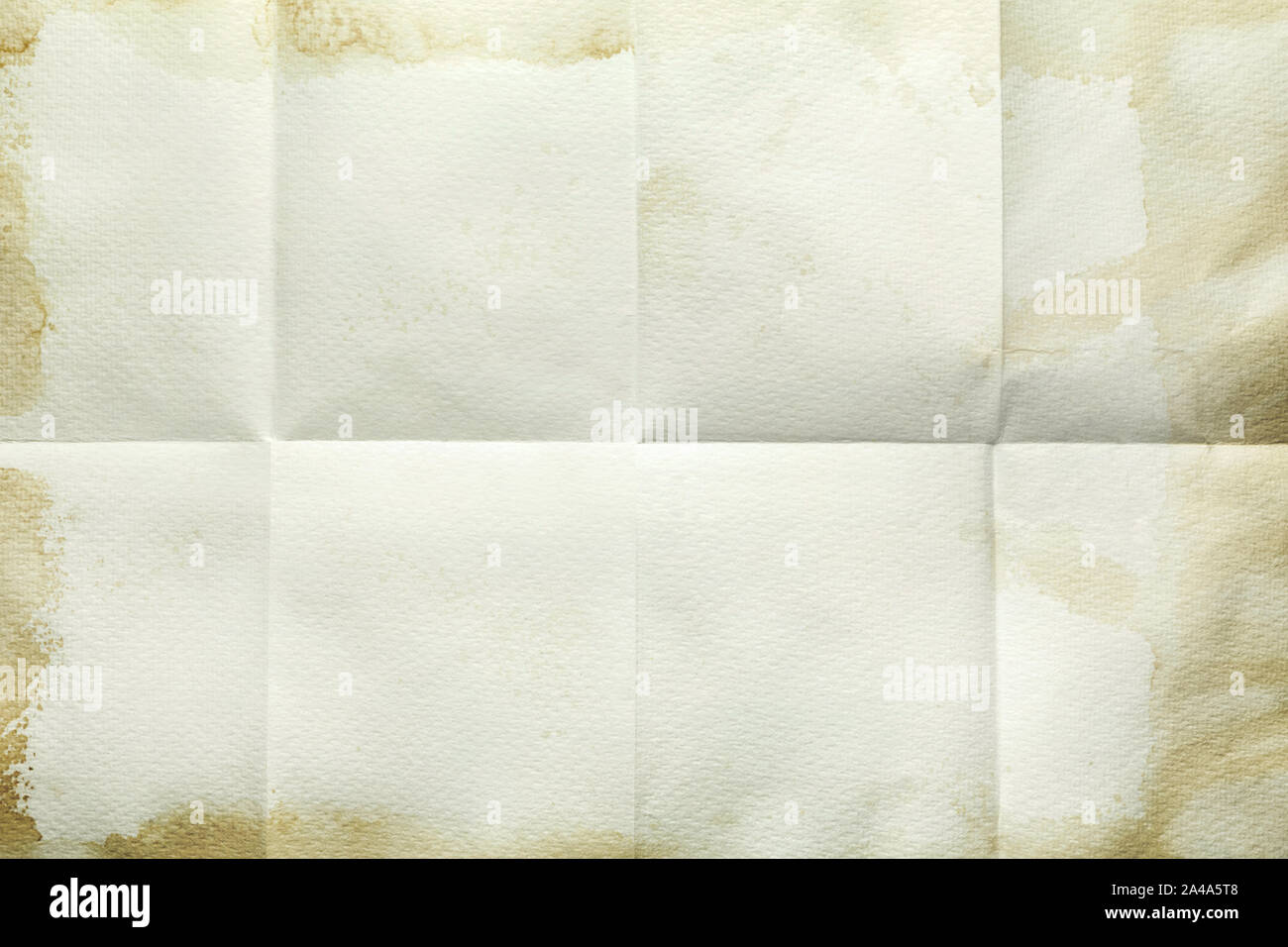 Empty paper sheet folded in eight, stained edges Stock Photo - Alamy