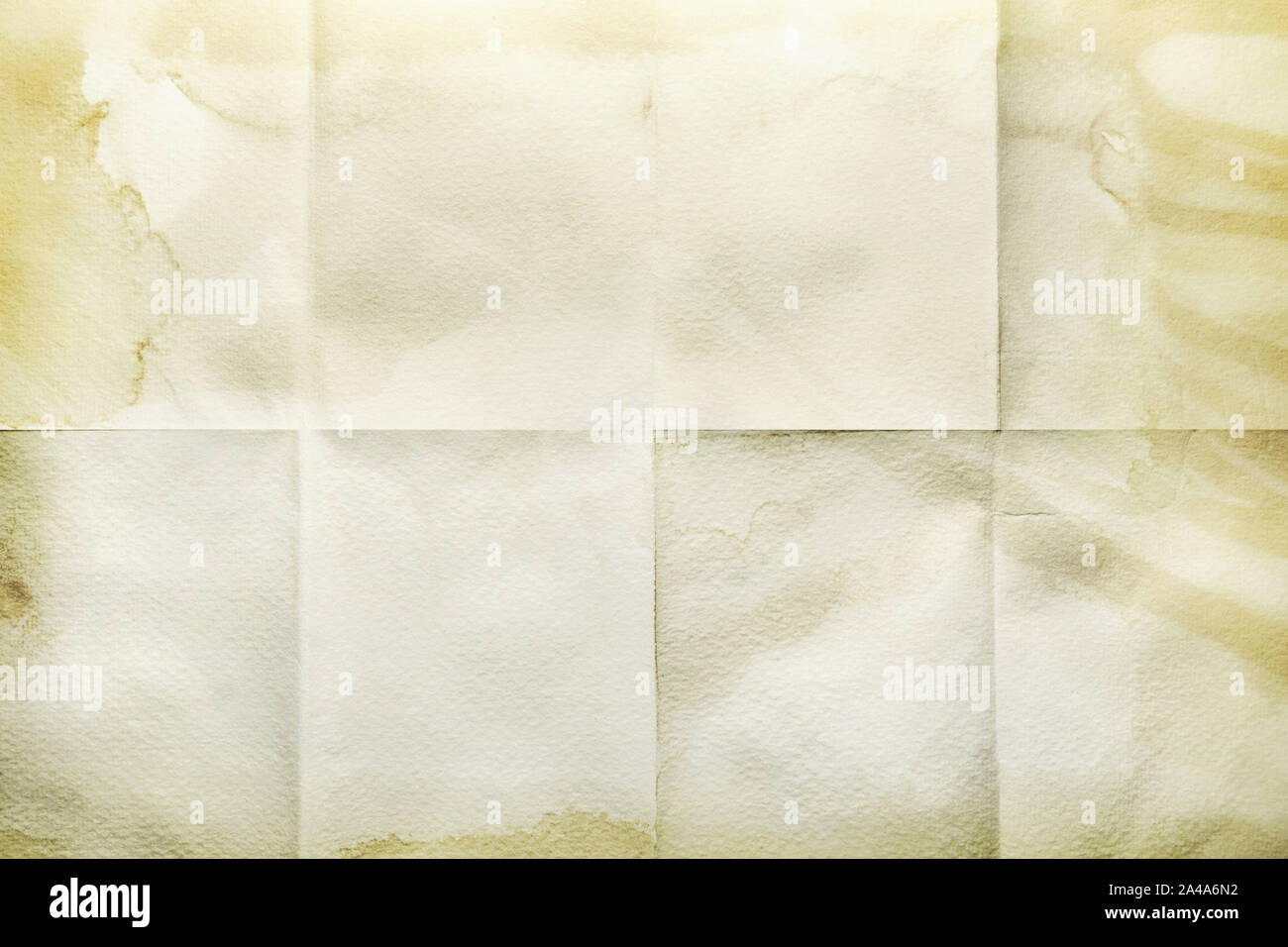Empty paper sheet folded in eight, stained edges Stock Photo - Alamy