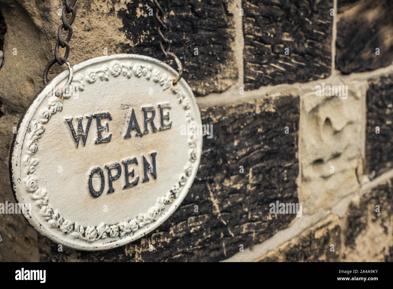 Open sign on wall Stock Photo - Alamy