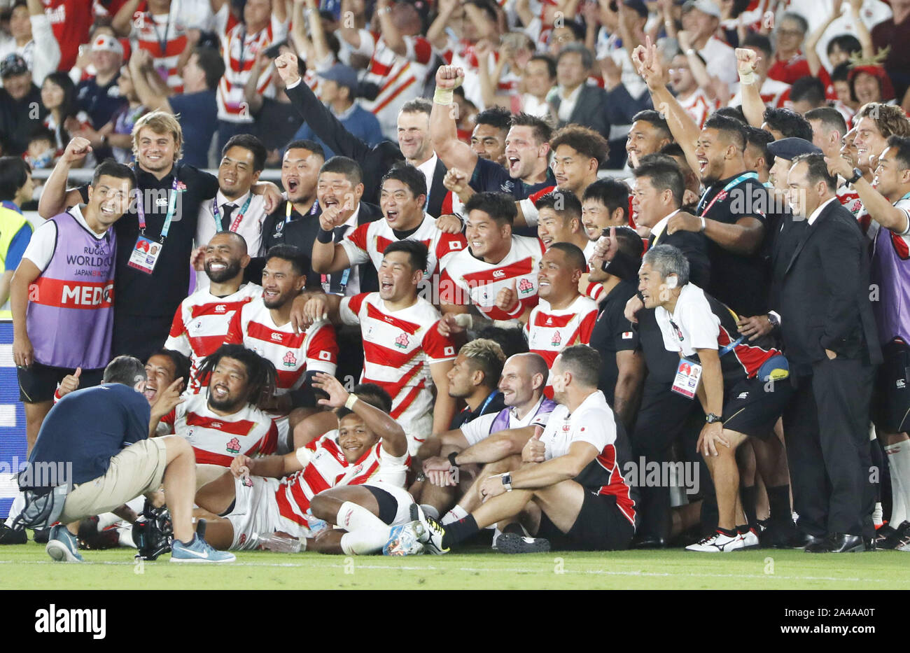 Japan players pose for a photo after defeating Scotland in a Rugby ...