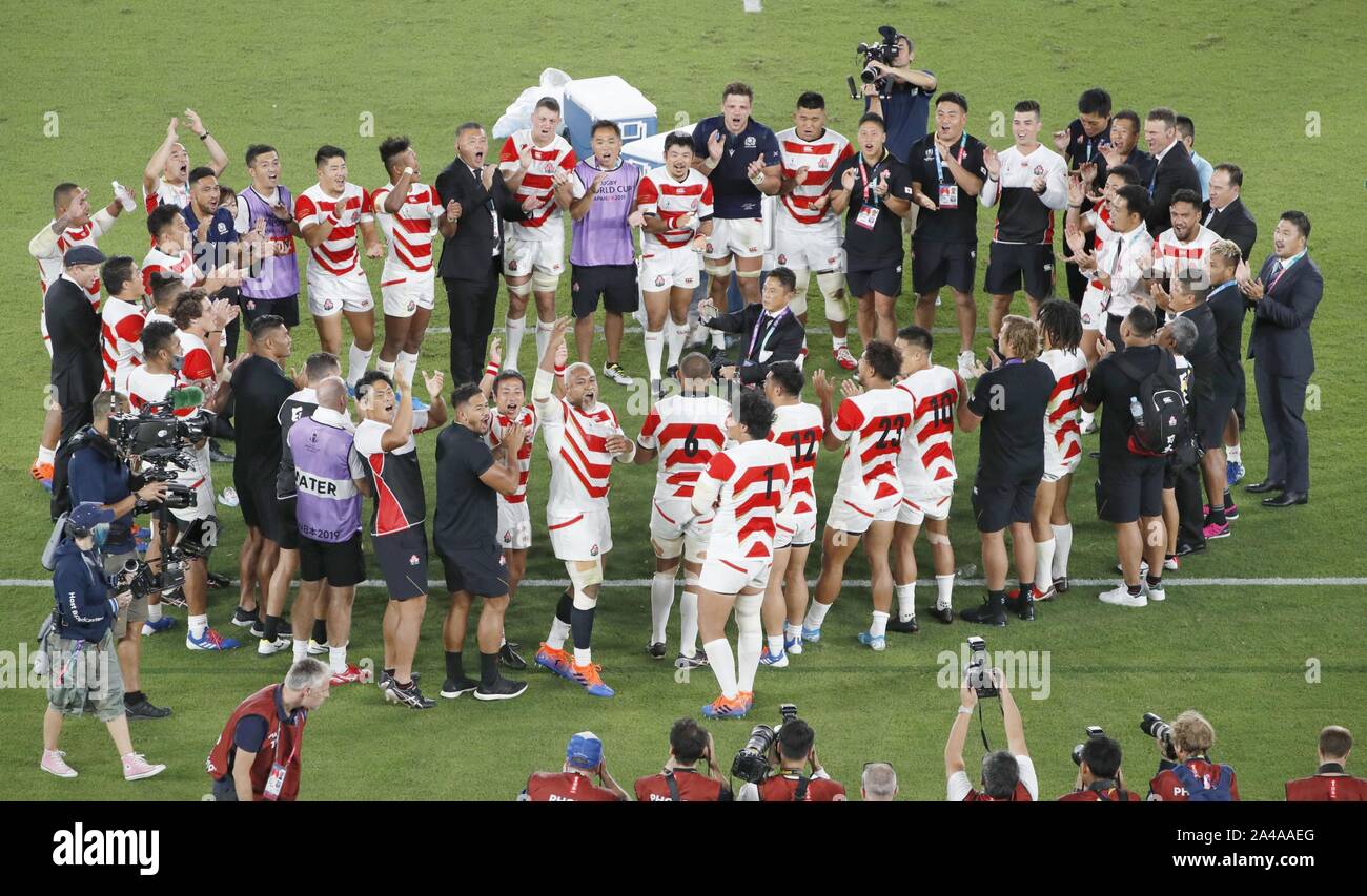 Japan players celebrate after beating, UK. , . in Yokohama, near Tokyo ...