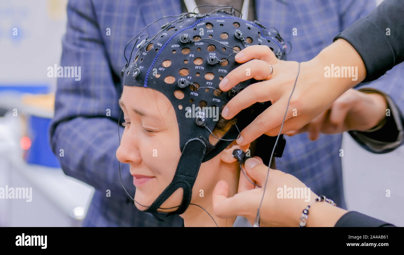 Teenager girl with medical eeg headset Stock Photo - Alamy