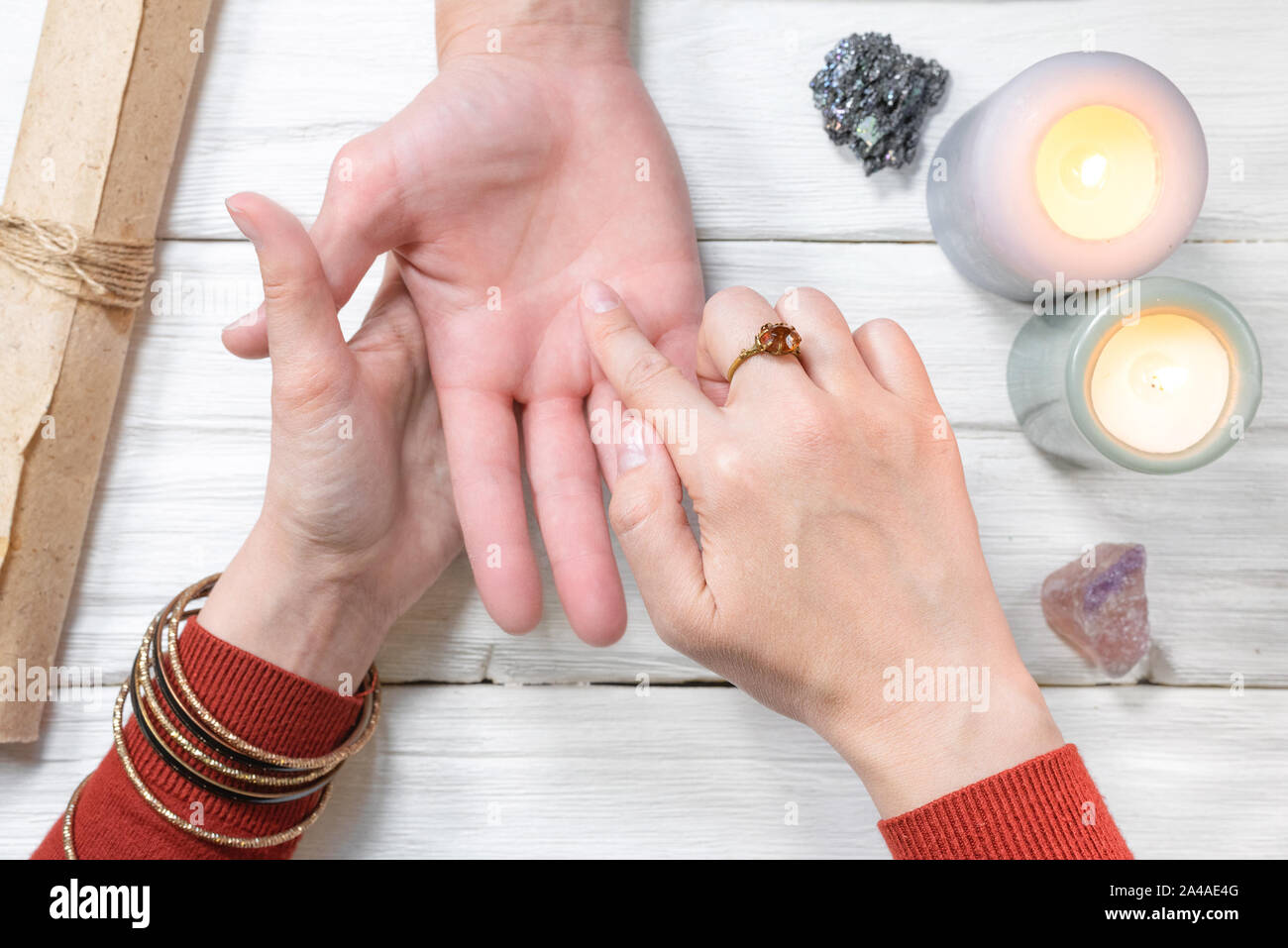 Fortune teller reading future by the hand. Palmistry Stock Photo - Alamy