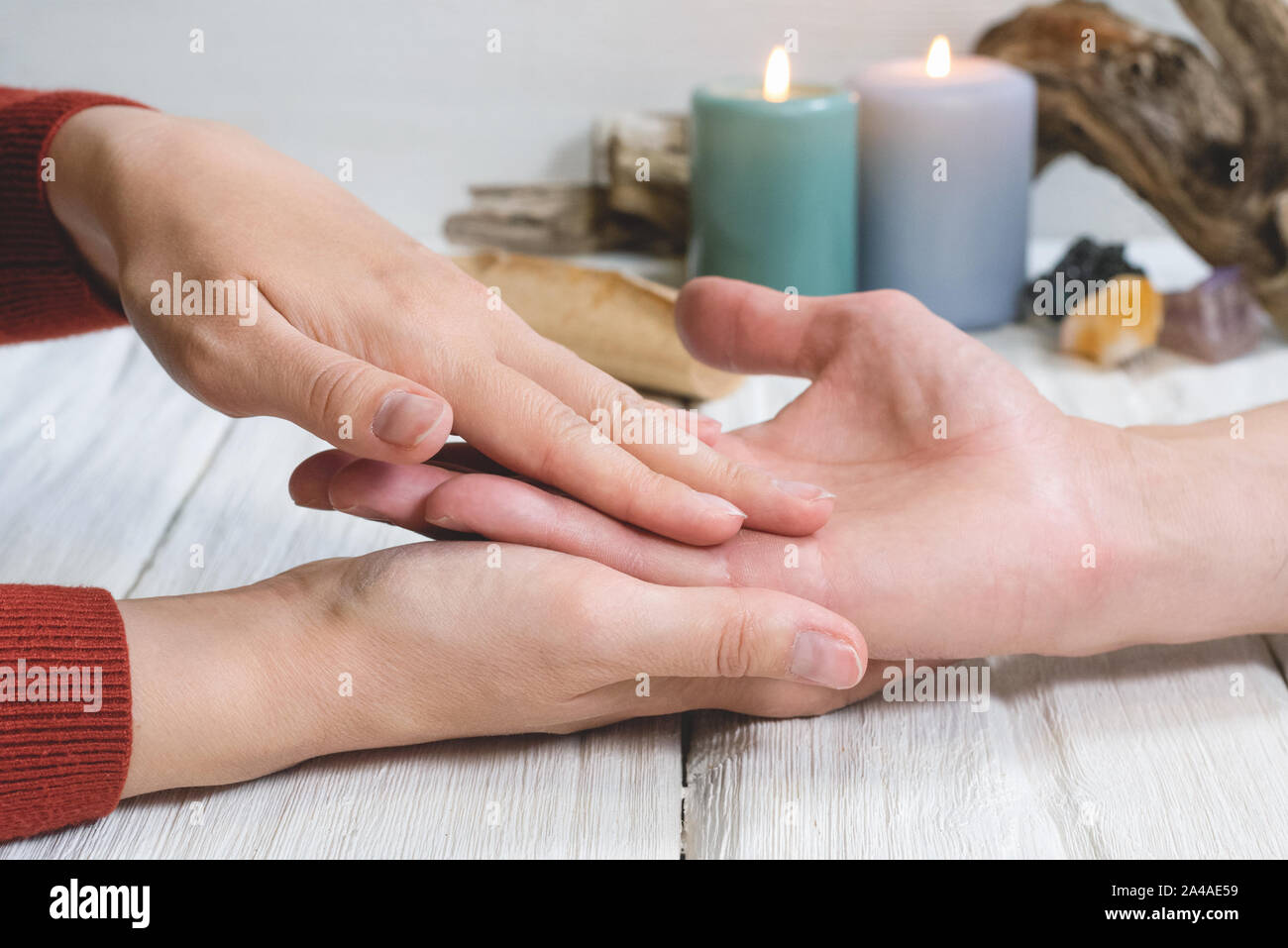 Fortune teller reading future by the hand. Palmistry Stock Photo - Alamy