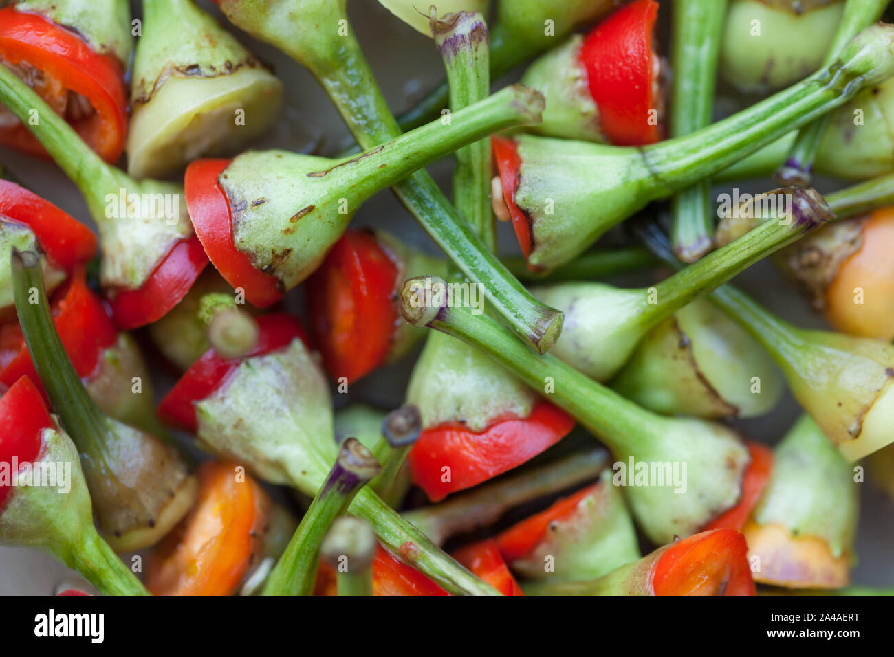 Cut tails of chili peppers in macro scale Stock Photo - Alamy