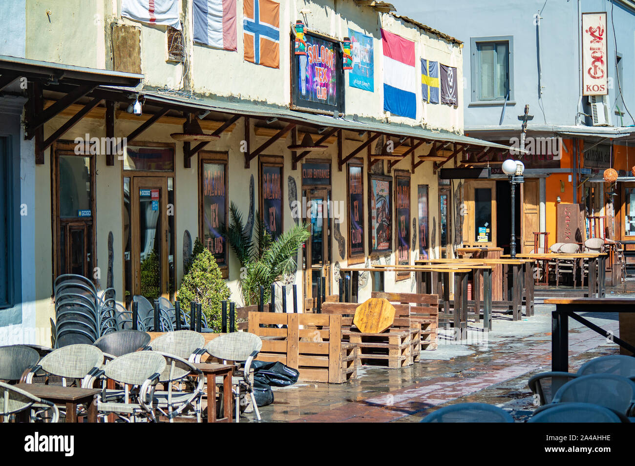 Bar Street in Kos town, during the daytime Stock Photo - Alamy