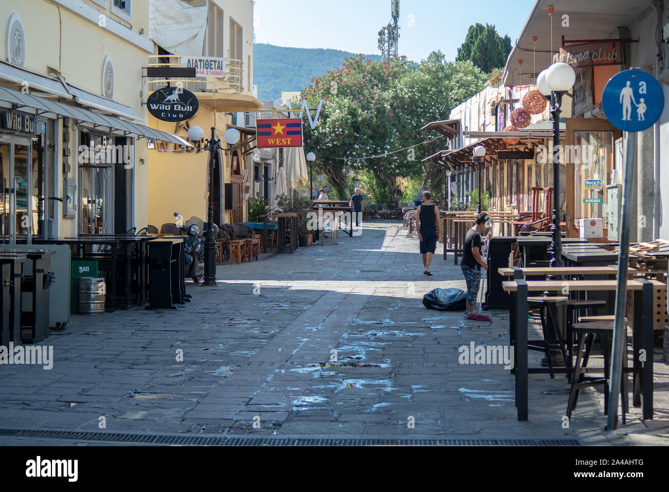 Bar Street in Kos town, during the daytime Stock Photo - Alamy