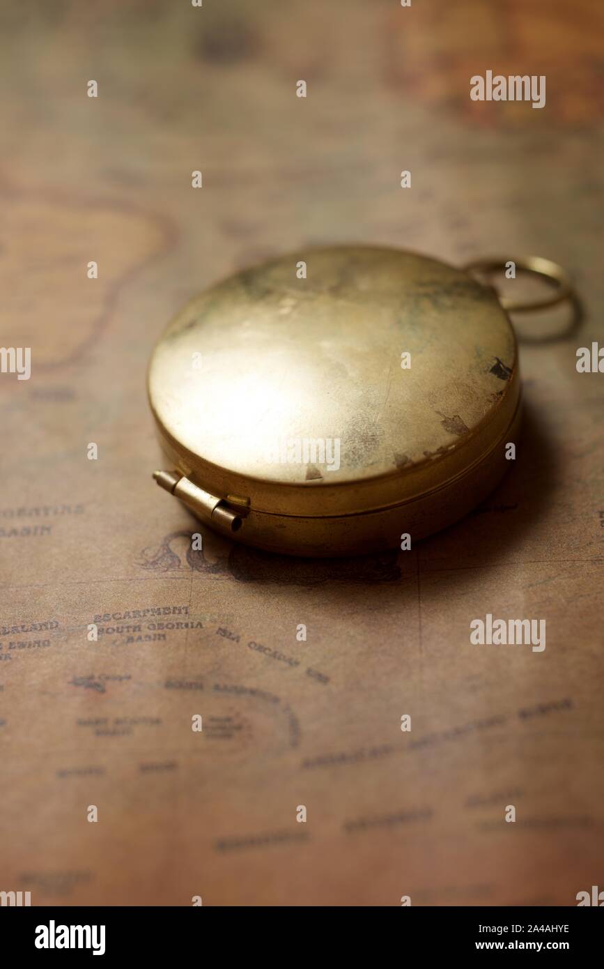 Vintage compass and old navigation map Stock Photo - Alamy
